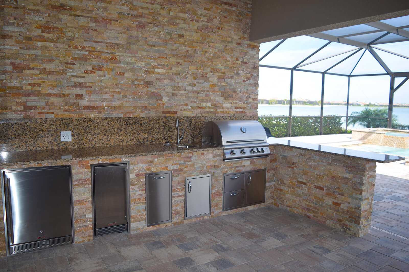 Stacked Stone and Granite Paradise Kitchen - Elegant Outdoor Kitchens