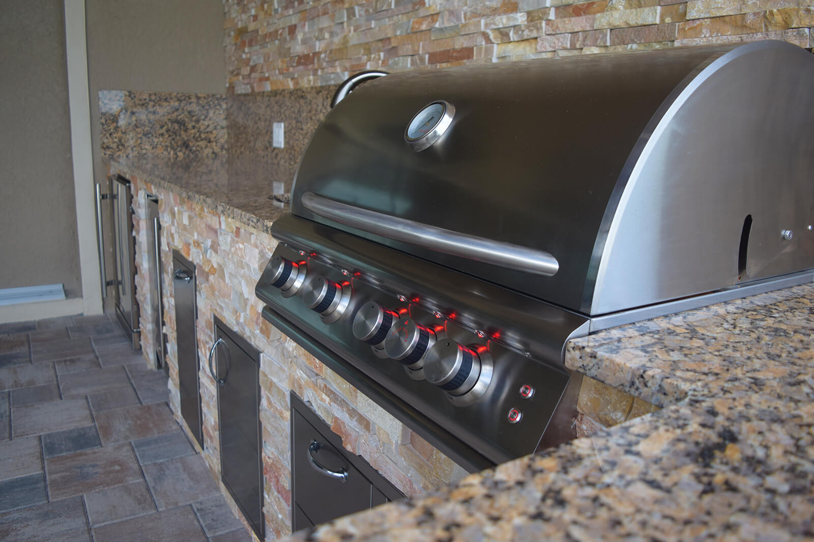 Stacked Stone and Granite Paradise Kitchen - Elegant Outdoor Kitchens